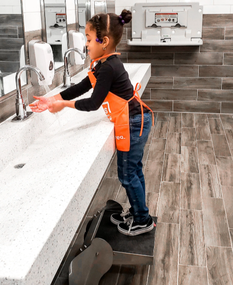 Step 'n Wash - self retracting step stool for commercial restrooms